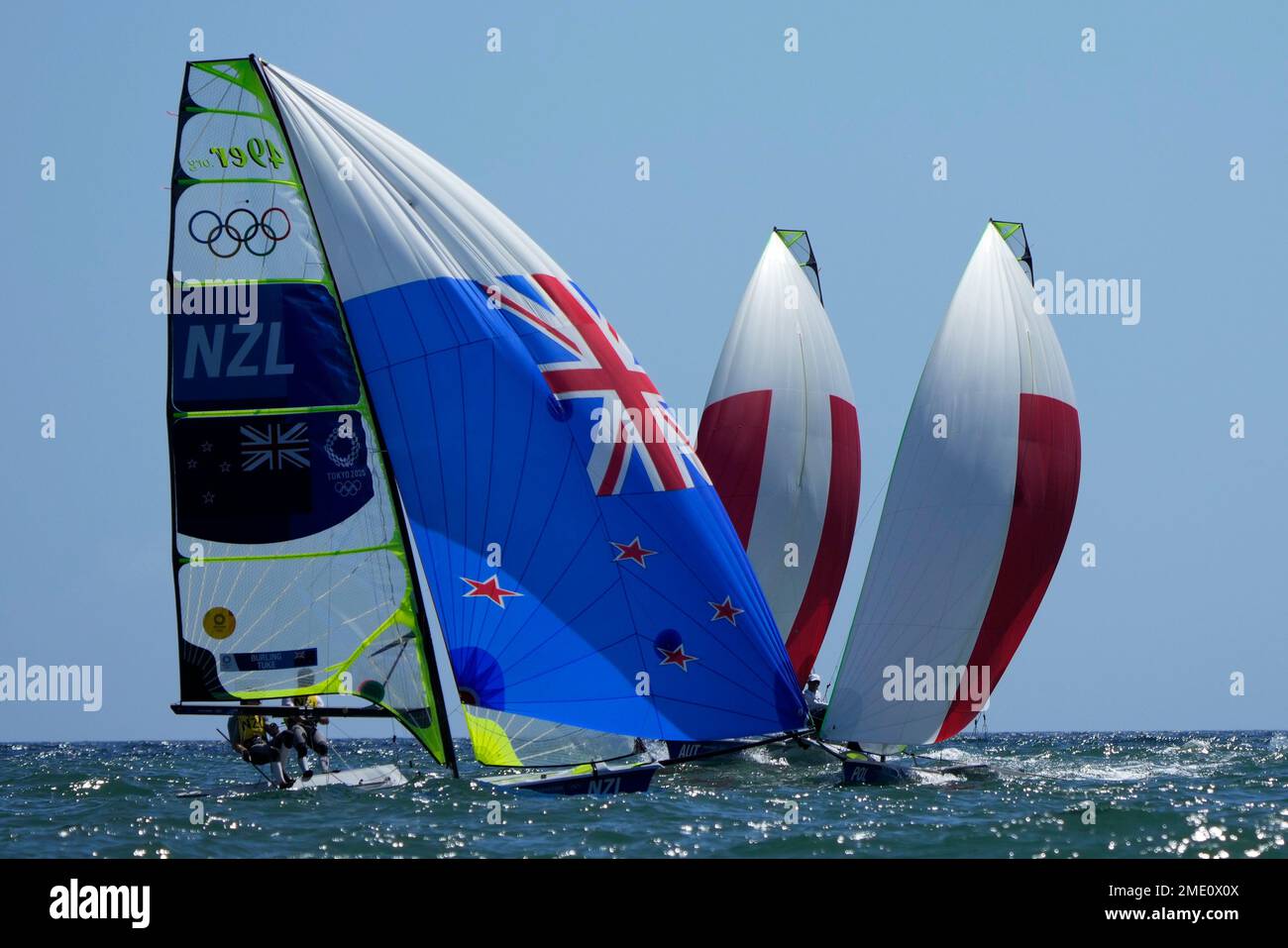 New Zealand's Peter Burling and Blair Tuke, center, compete in the men ...