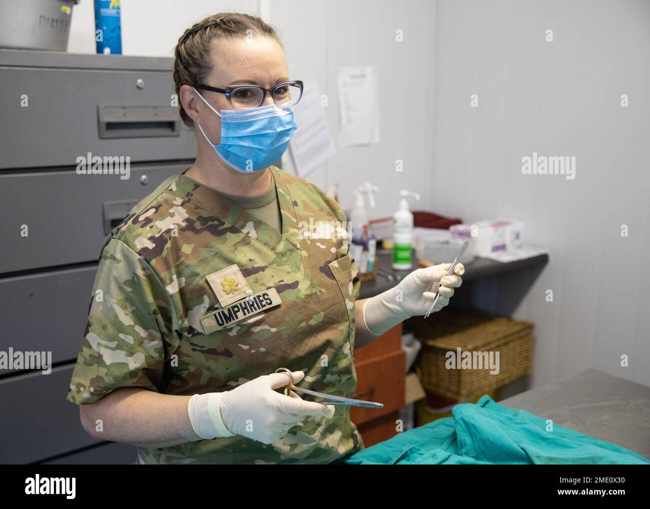 U.S. Army Maj. Sage Umpheries, a veterinarian assigned to the 353rd ...