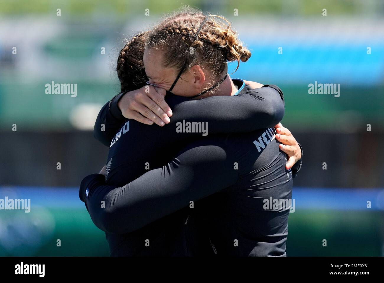 Lisa Carrington, left, and Caitlin Regal, of New Zealand, embrace after ...