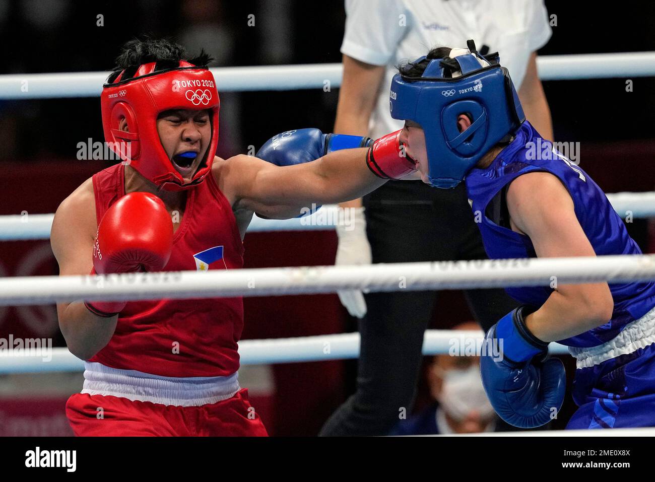 Philippines's Nesthy Petecio, left, exchanges punches with Japan's Sena Irie during their women ...