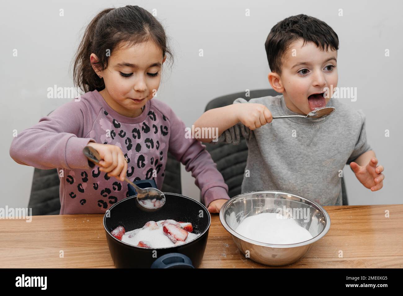 Portrait Of Happy Children Preparing Strawberry Jam, Eating Tasty ...