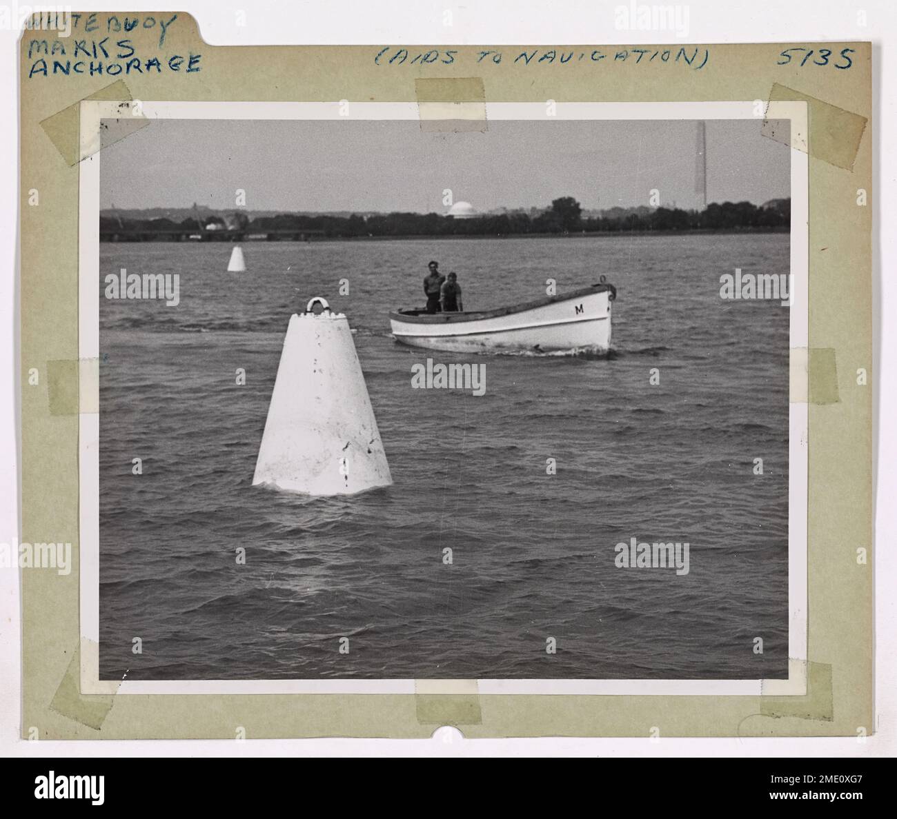 Coast Guard-maintained buoys, painted white, mark anchorage areas such ...