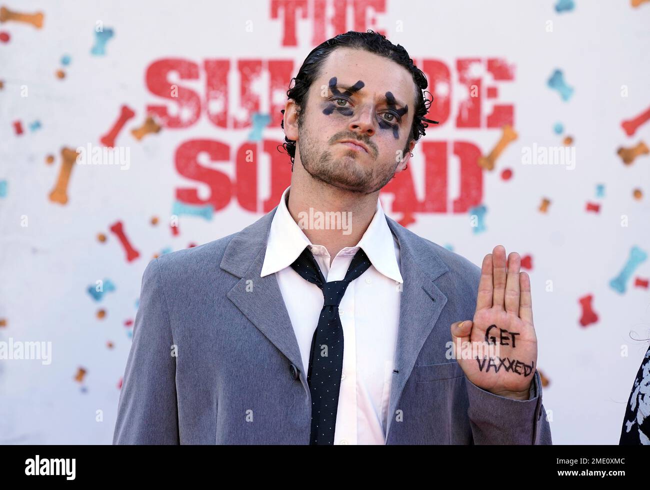 Singer Grandson holds up a "Get Vaxxed" message on his hand at the ...