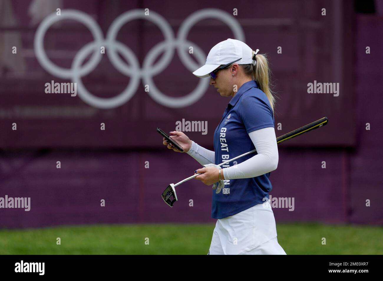 Jodi Ewart Shadoff, of Britian, checks her phone on the 10th green ...