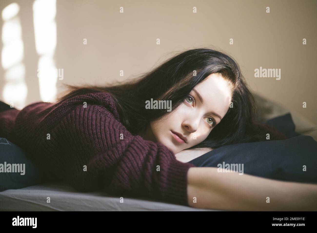 Young Beautiful Woman Daydreaming And Thinking While Looking Out Of The ...