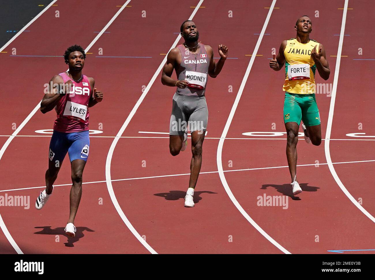 Noah Lyles, of United States, Brendon Rodney, of Canada and Julian ...