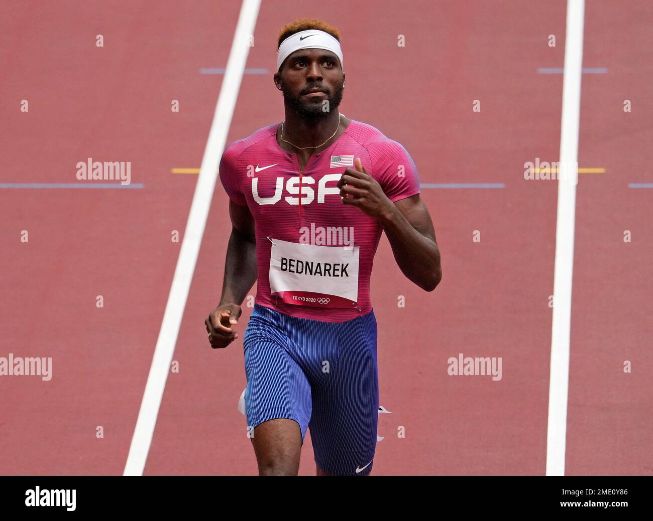 Kenneth Bednarek, of United States crosses the line to win a men's 200 ...