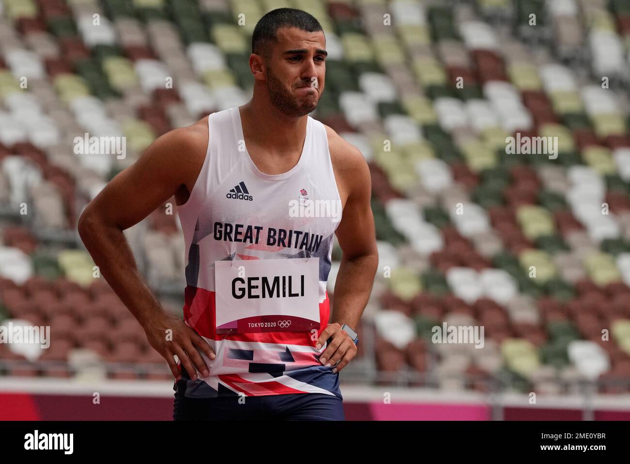 Adam Gemili, of Britain, walks along the track following his heat of ...
