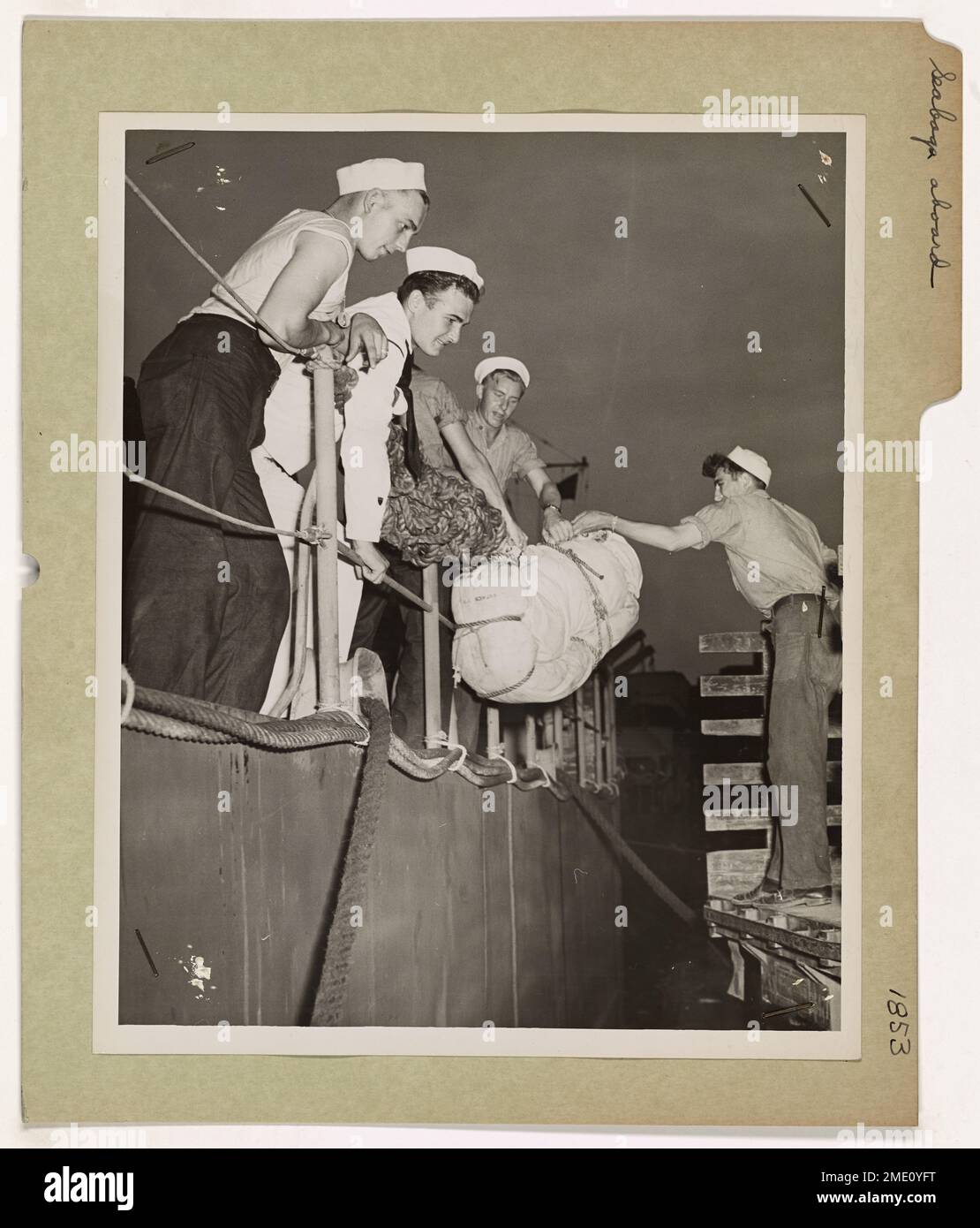 Coast Guardsmen are seen loading their seabags onto a Coast Guard ...