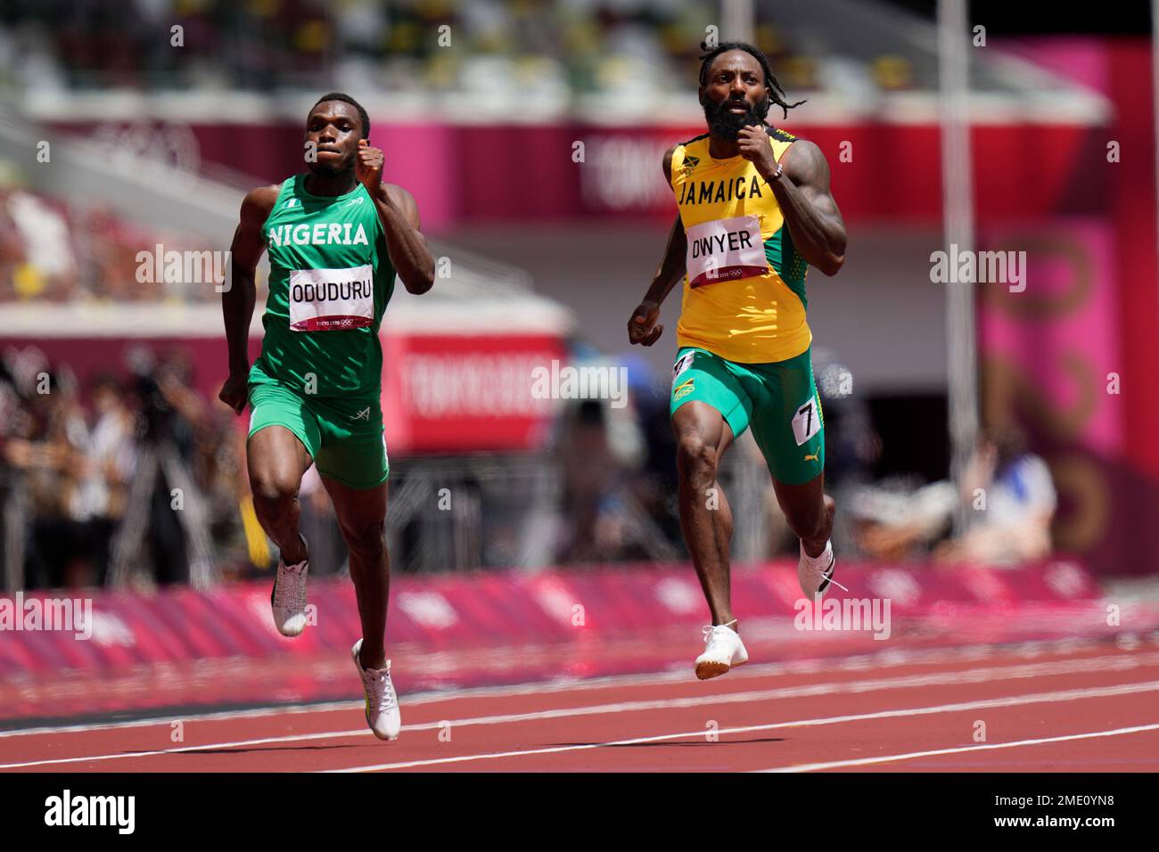 Rasheed Dwyer, of Jamaica, and Divine Oduduru, left, of Nigeria, compete in a heat of the men's ...