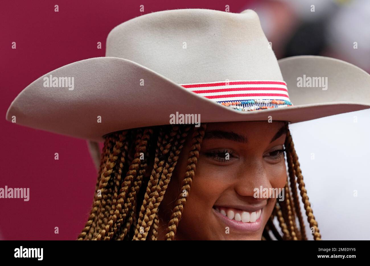 Tara Davis, of United States smiles as she arrives for the start of the ...