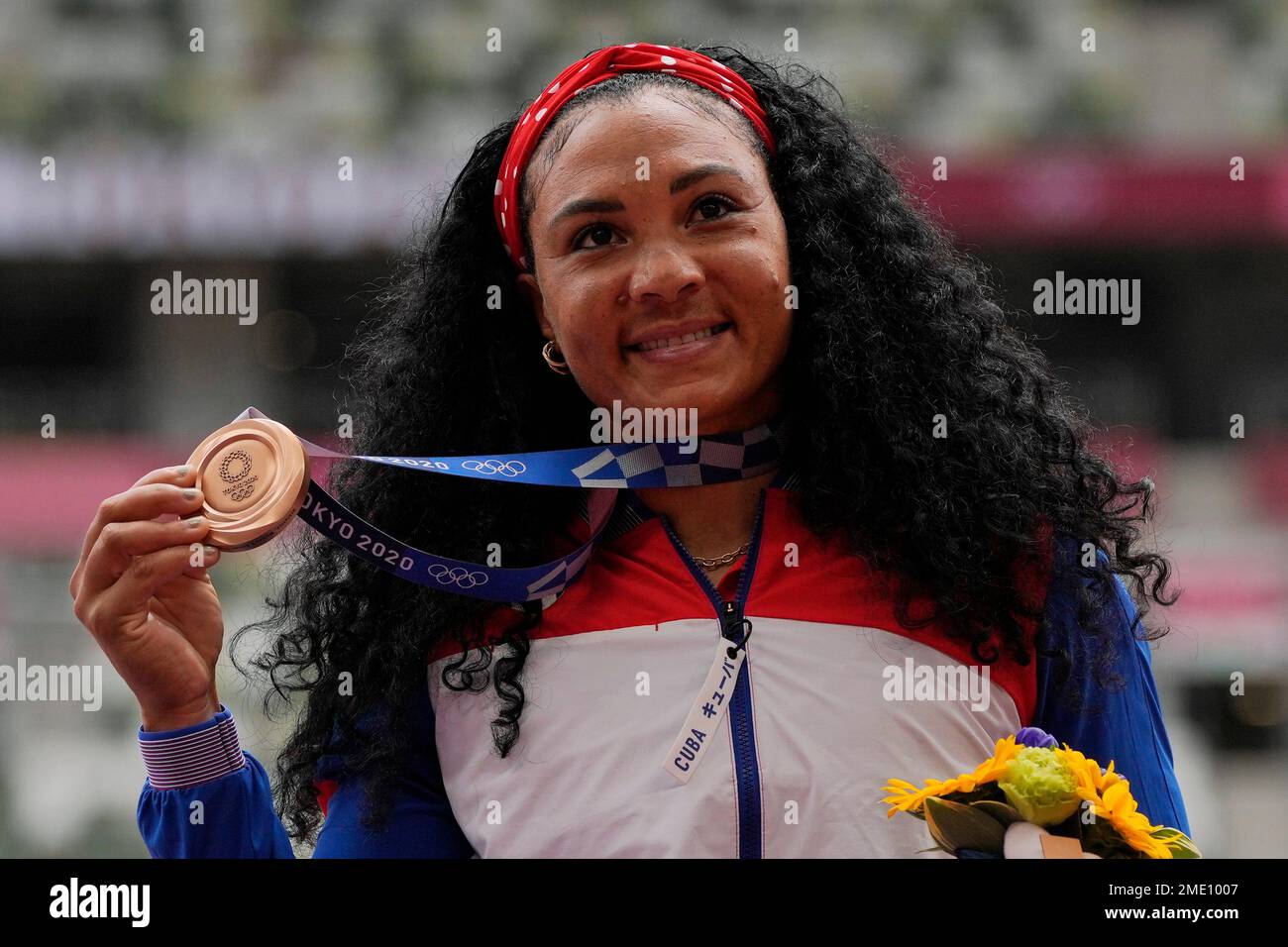 Yaime Perez, of Cuba, holds her bronze medal on the podium for the ...