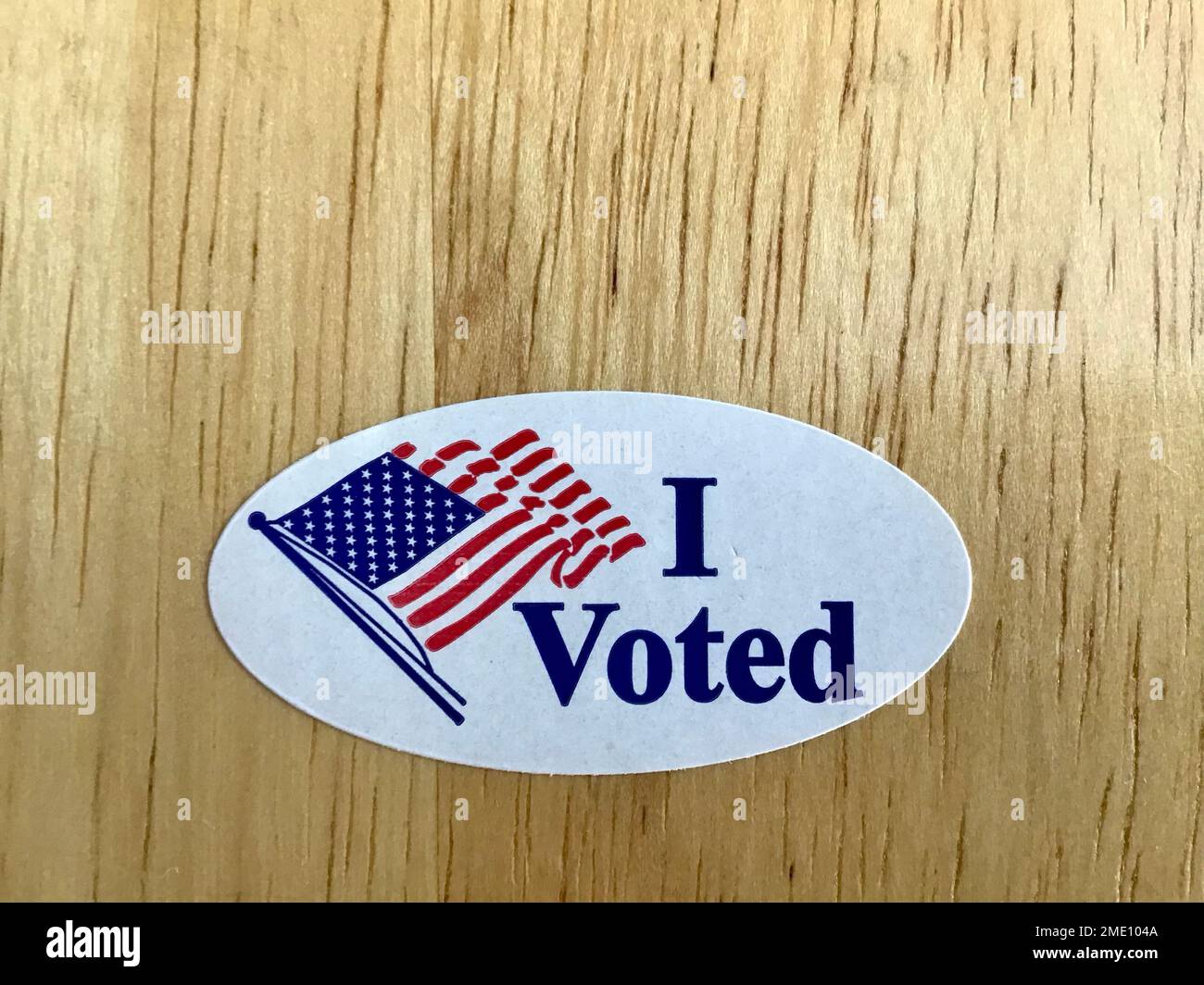 Oval paper sticker verifying person voted Stock Photo - Alamy