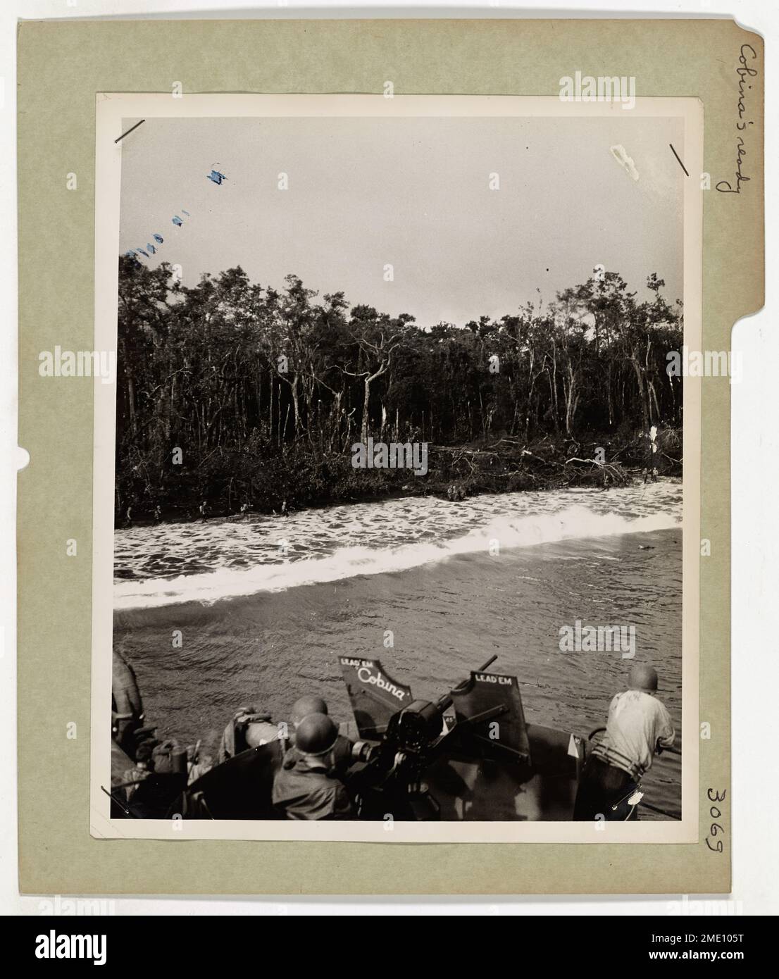U.S. Coast Guard gunners aboard an LST (Landing Ship, Tank) named ...