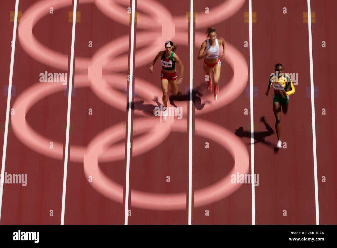Stephenie Mcpherson, of Jamaica, wins her heat during the women's 400 ...