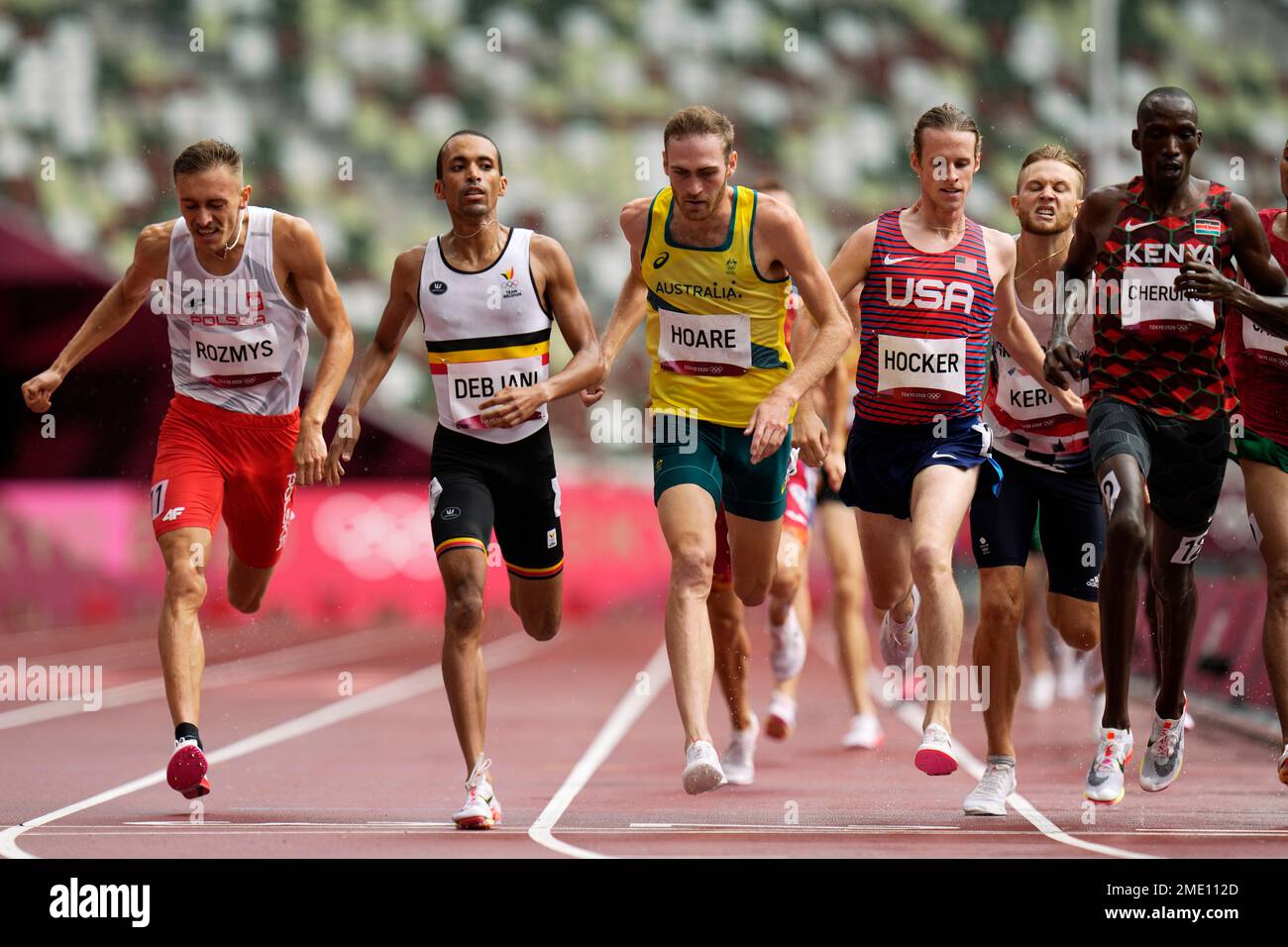 Runners cross the finish line in a heat of the men's 1,500-meters at ...