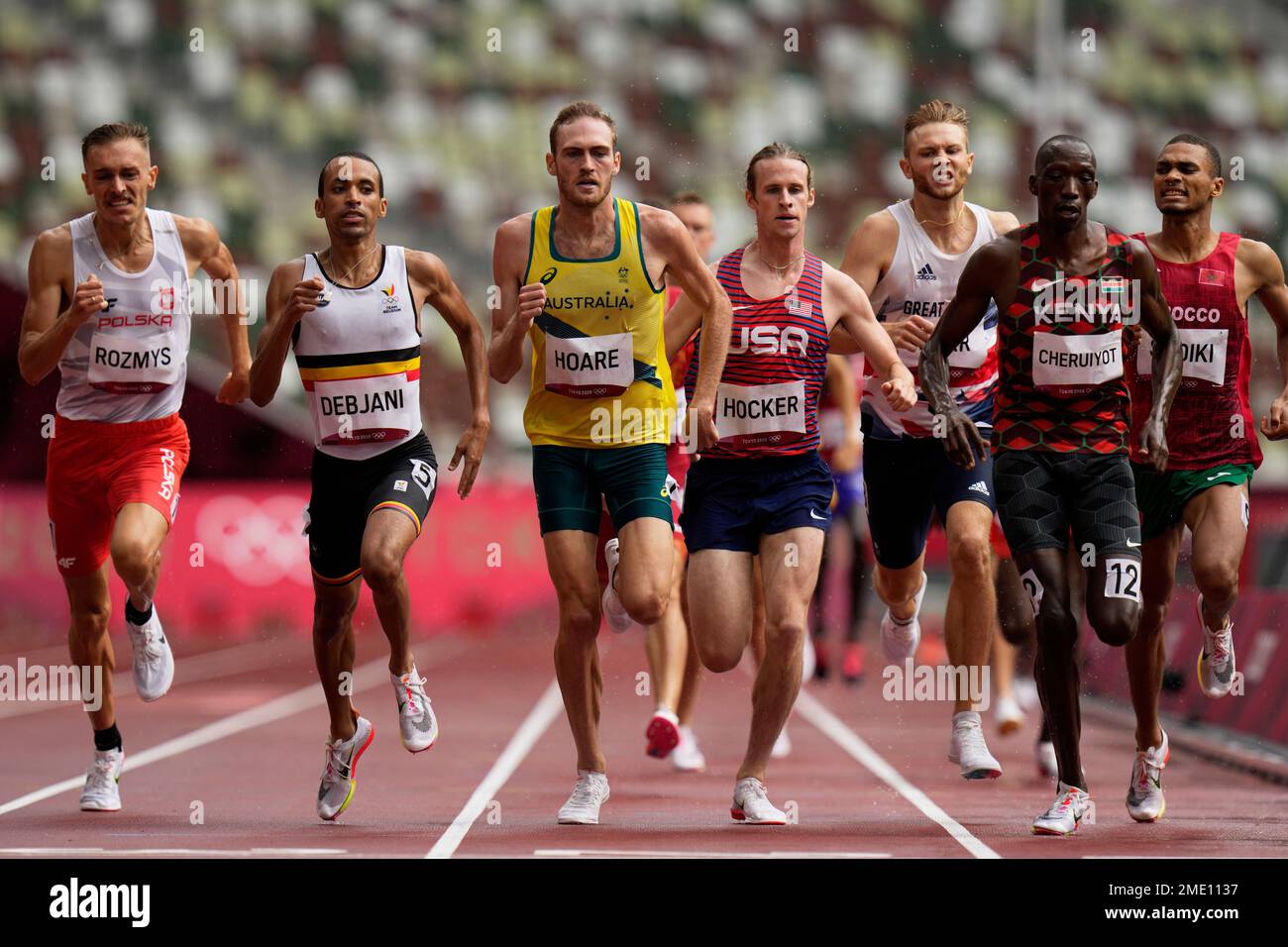 Runners sprint to the finish line in a heat of the men's 1,500-meters ...