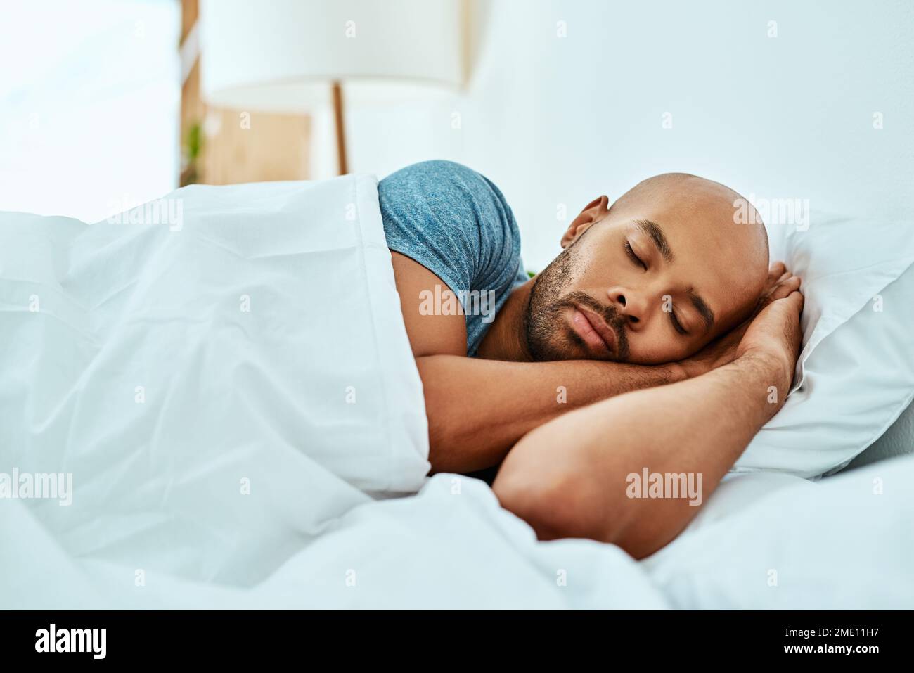This is what weekends are about...a young man sleeping in his bed Stock ...