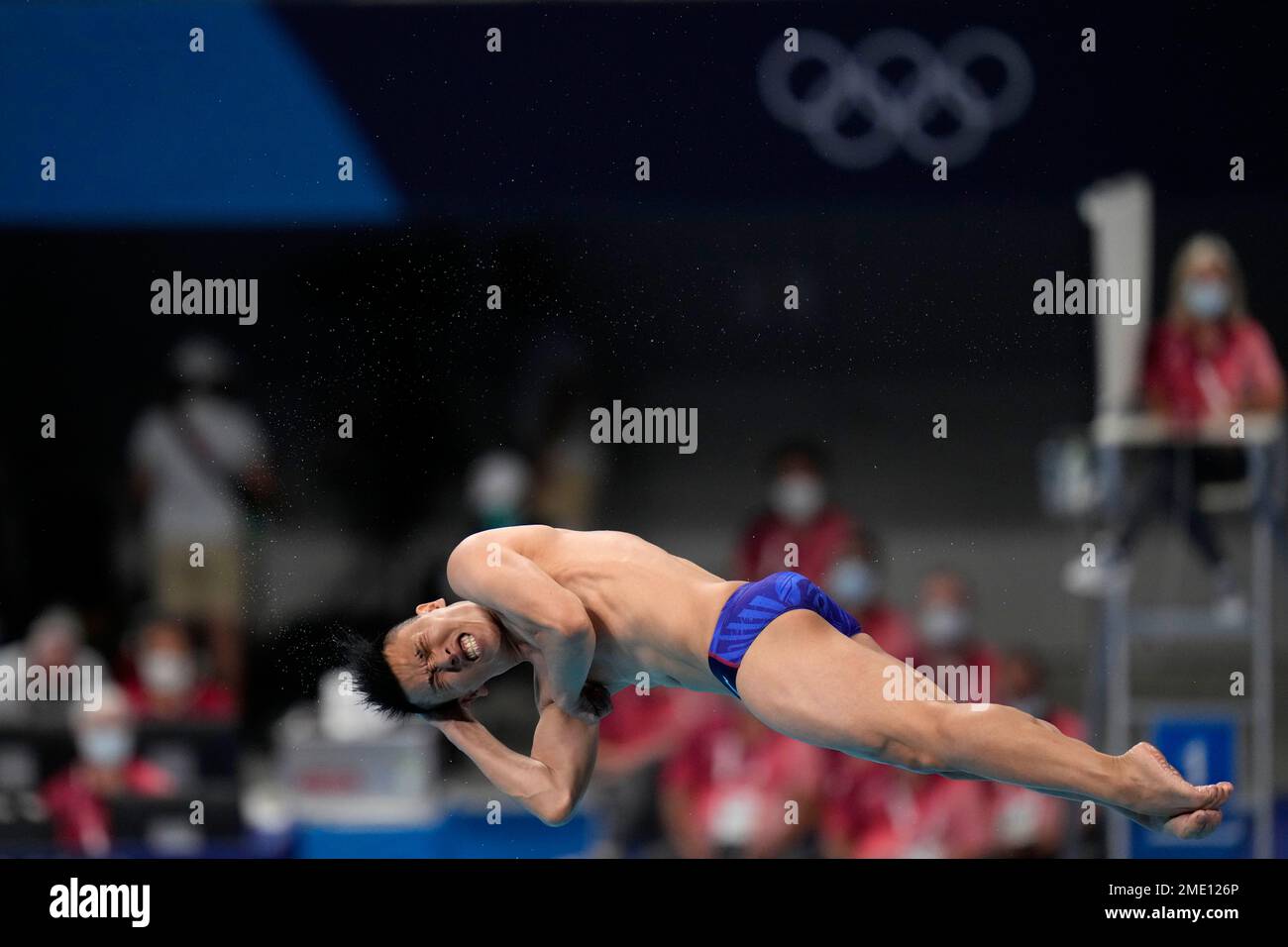 Ken Terauchi of Japan competes in men's diving 3m springboard ...