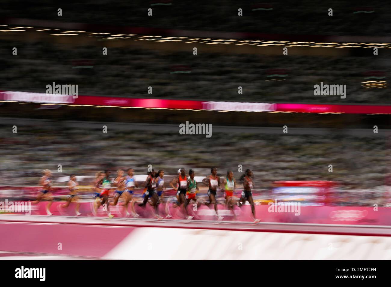 Runners compete in the women's 5,000-meters final at the 2020 Summer ...