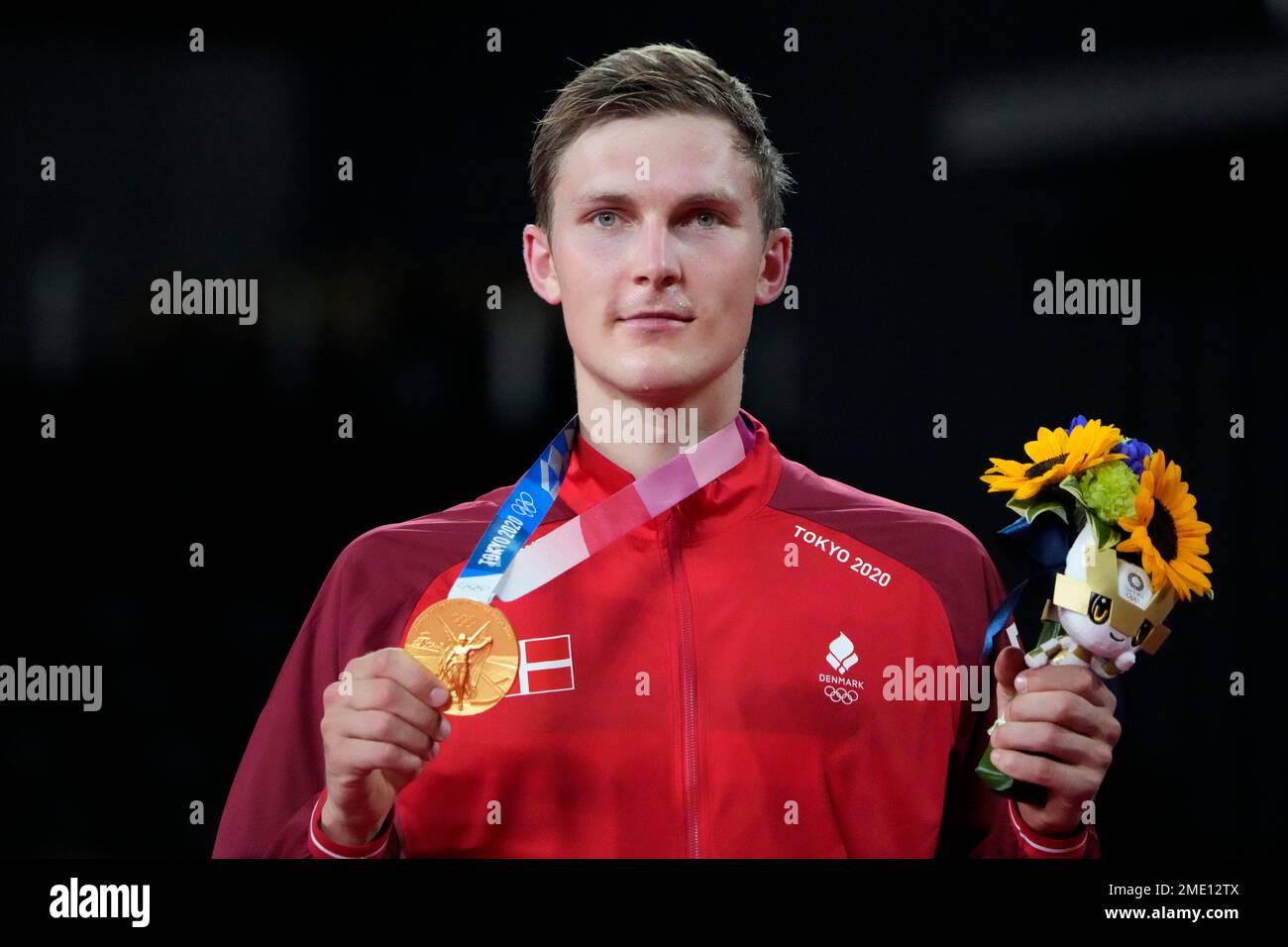 Gold medalist Denmark's Victor Axelsen poses during the medals ceremony ...