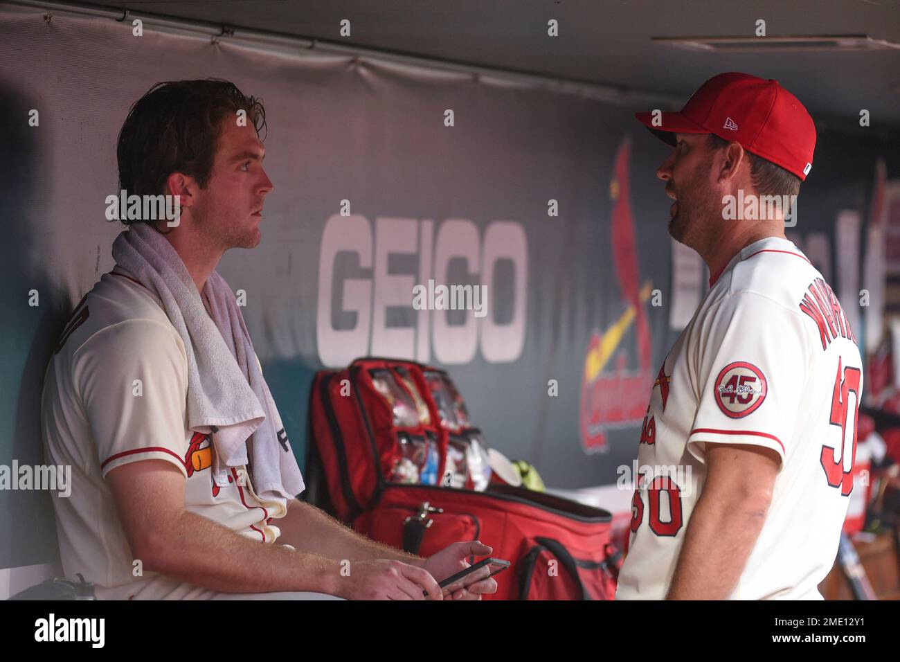 St. Louis Cardinals' Adam Wainwright, right, speaks with St. Louis ...