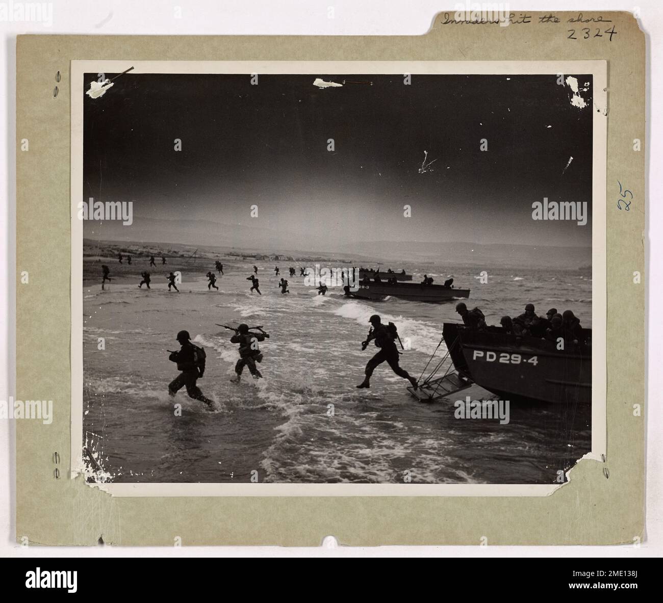 American troops, accompanied by Coast Guard-manned landing craft ...
