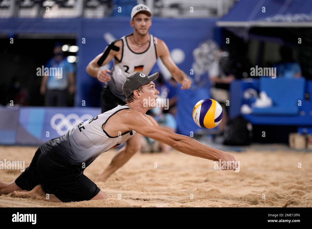 Germany's Julius Thole (1) returns a shot as Clemens Wickler (2) looks ...
