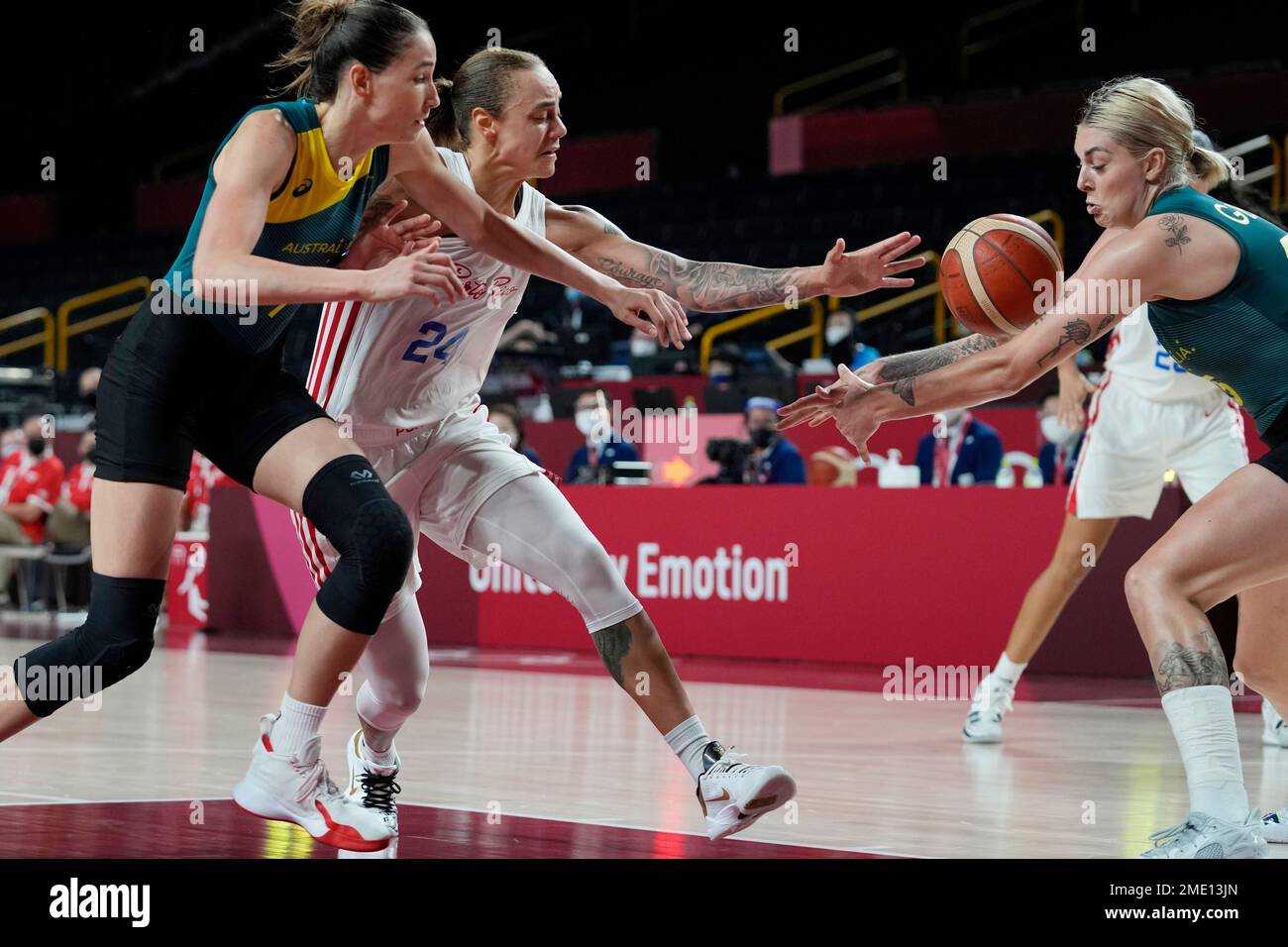 Australia's Bec Allen, left, and Australia's Cayla George, right, strip ...