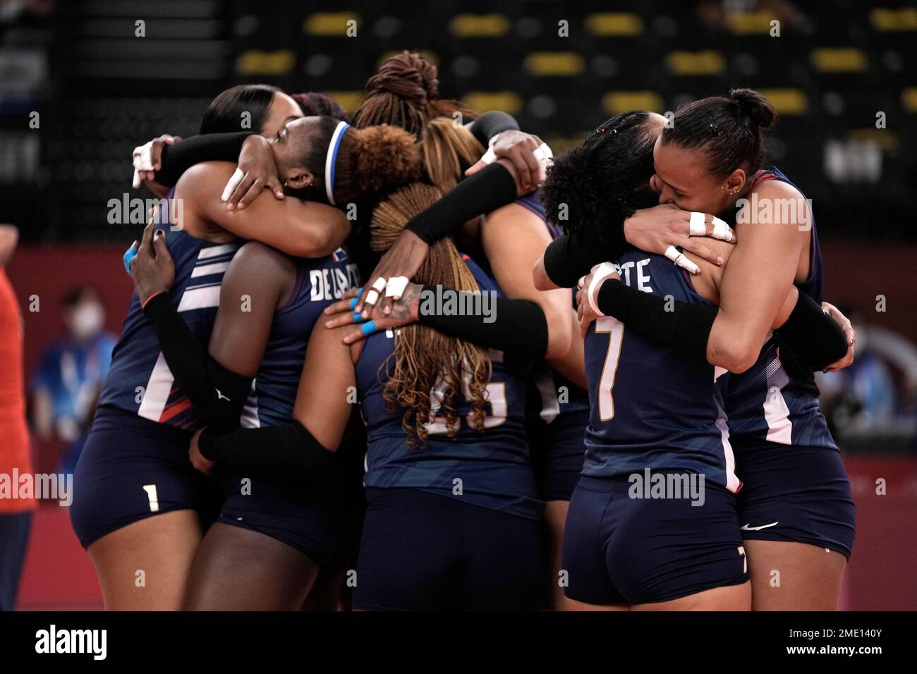 Team Dominican Republic embrace at the end of their women's volleyball ...