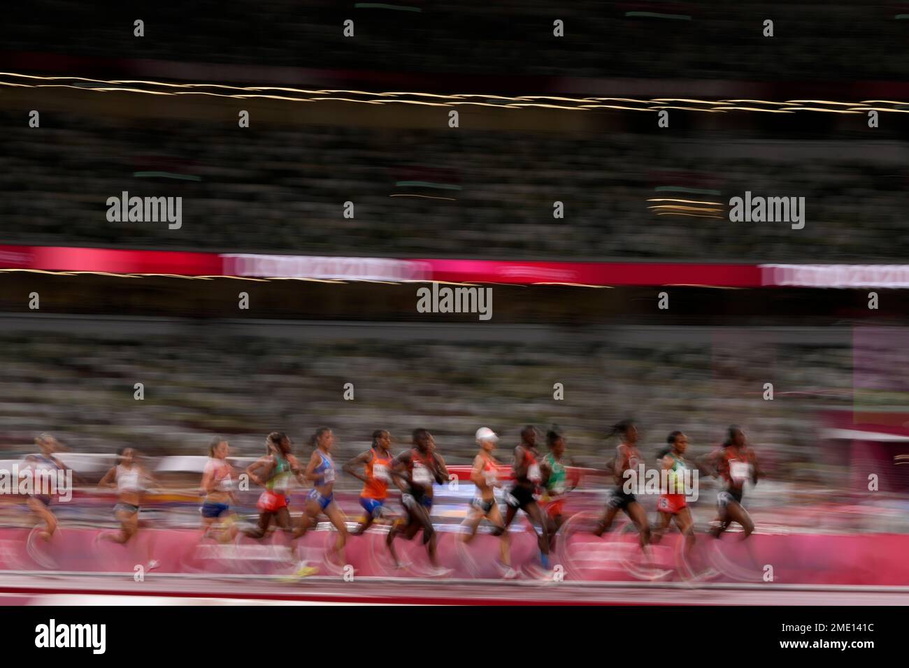 Runners compete in the women's 5,000-meters final at the 2020 Summer ...