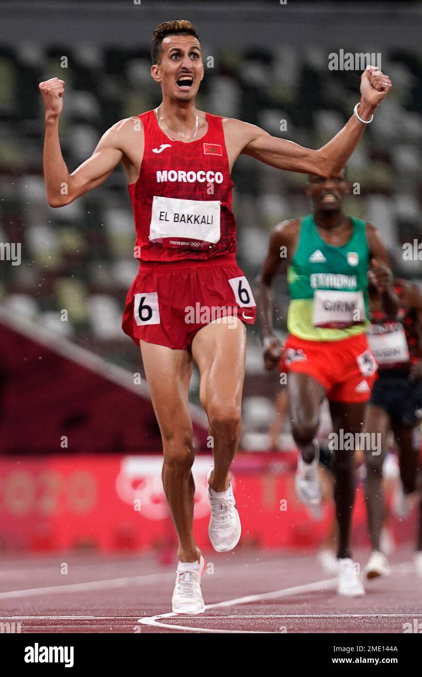 Soufiane El Bakkali, of Morocco, celebrates as he crosses the finish ...