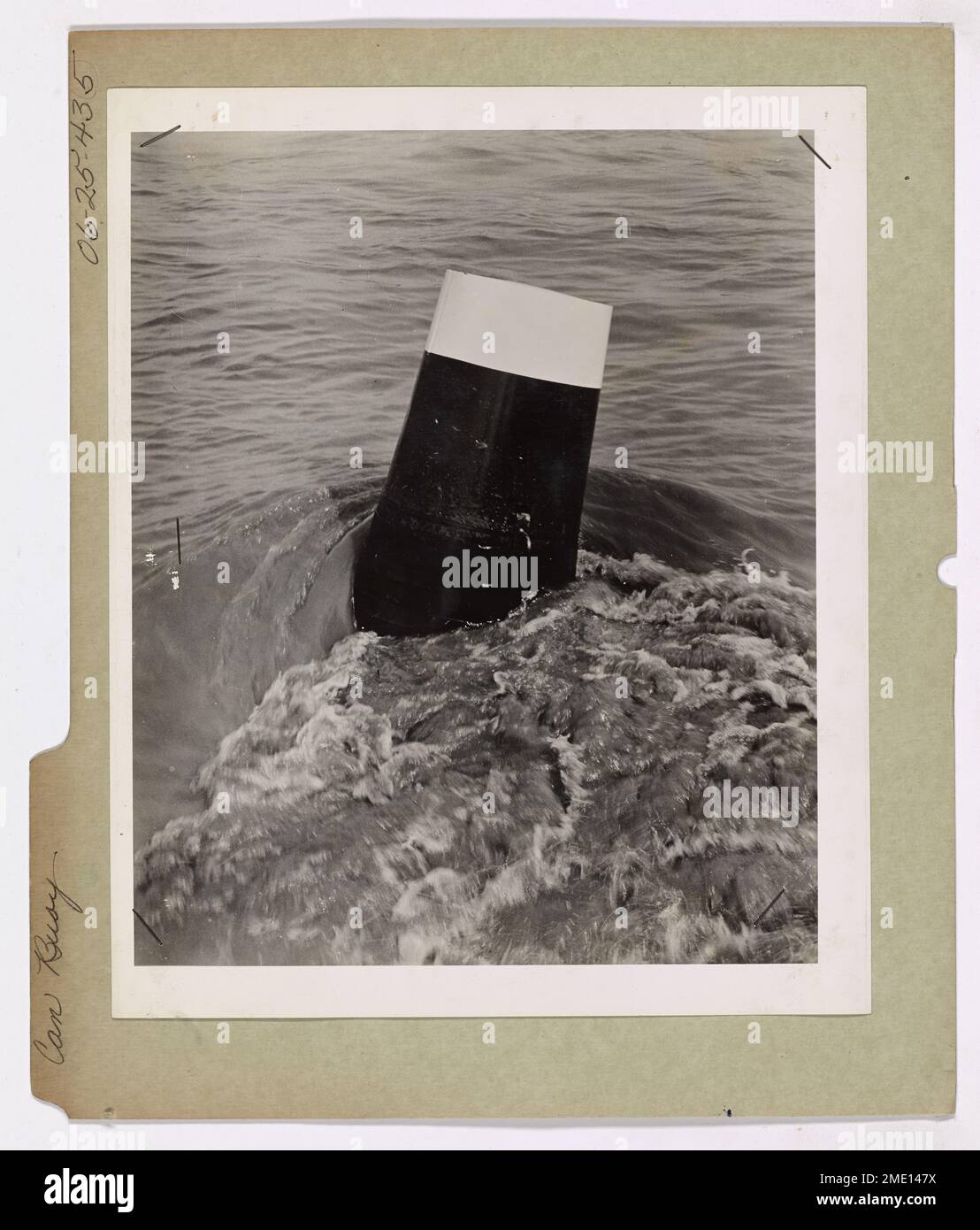 This image depicts a Coast Guard 'can buoy' marking navigational routes ...