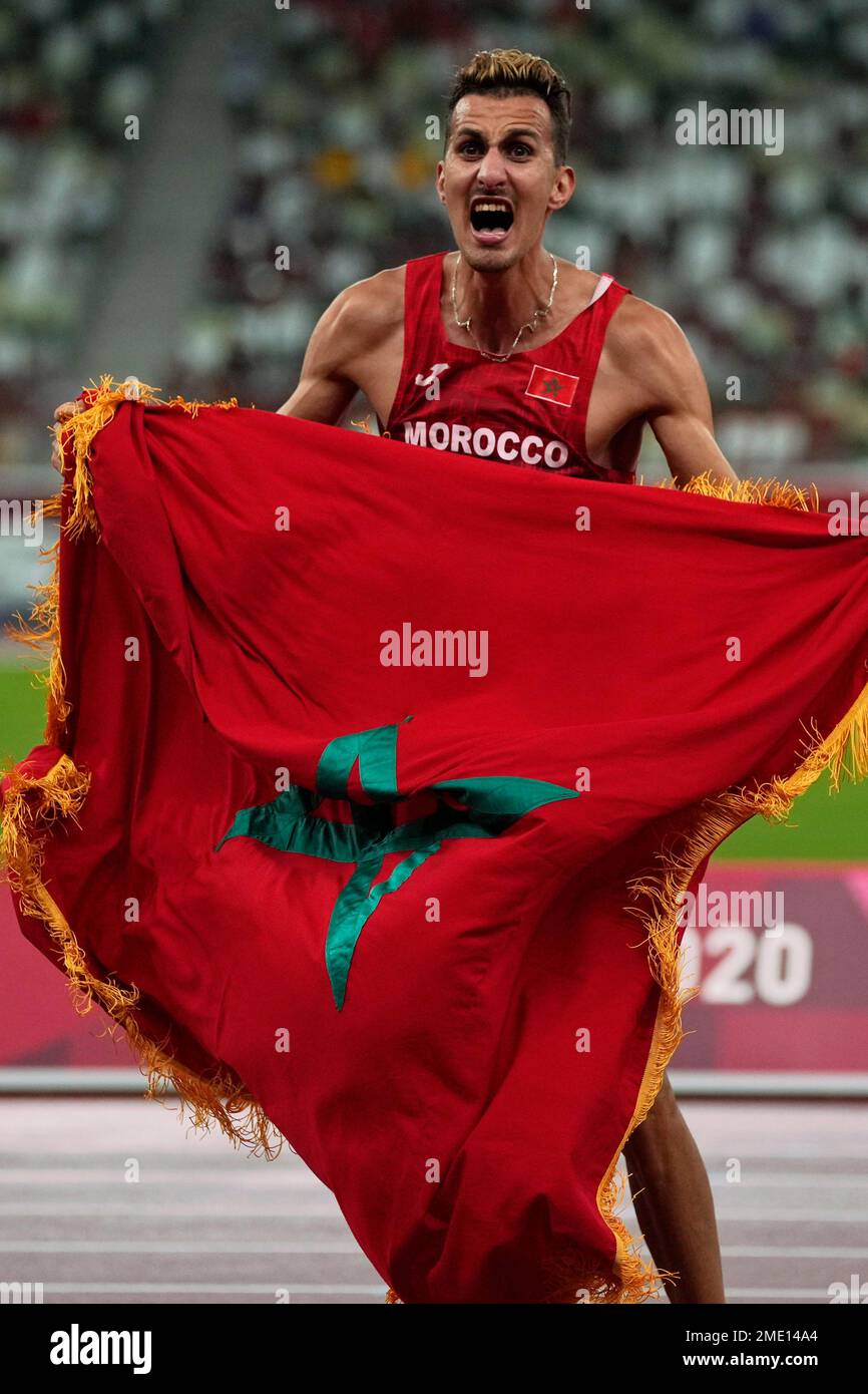 Soufiane El Bakkali, of Morocco, celebrates after winning the men's ...