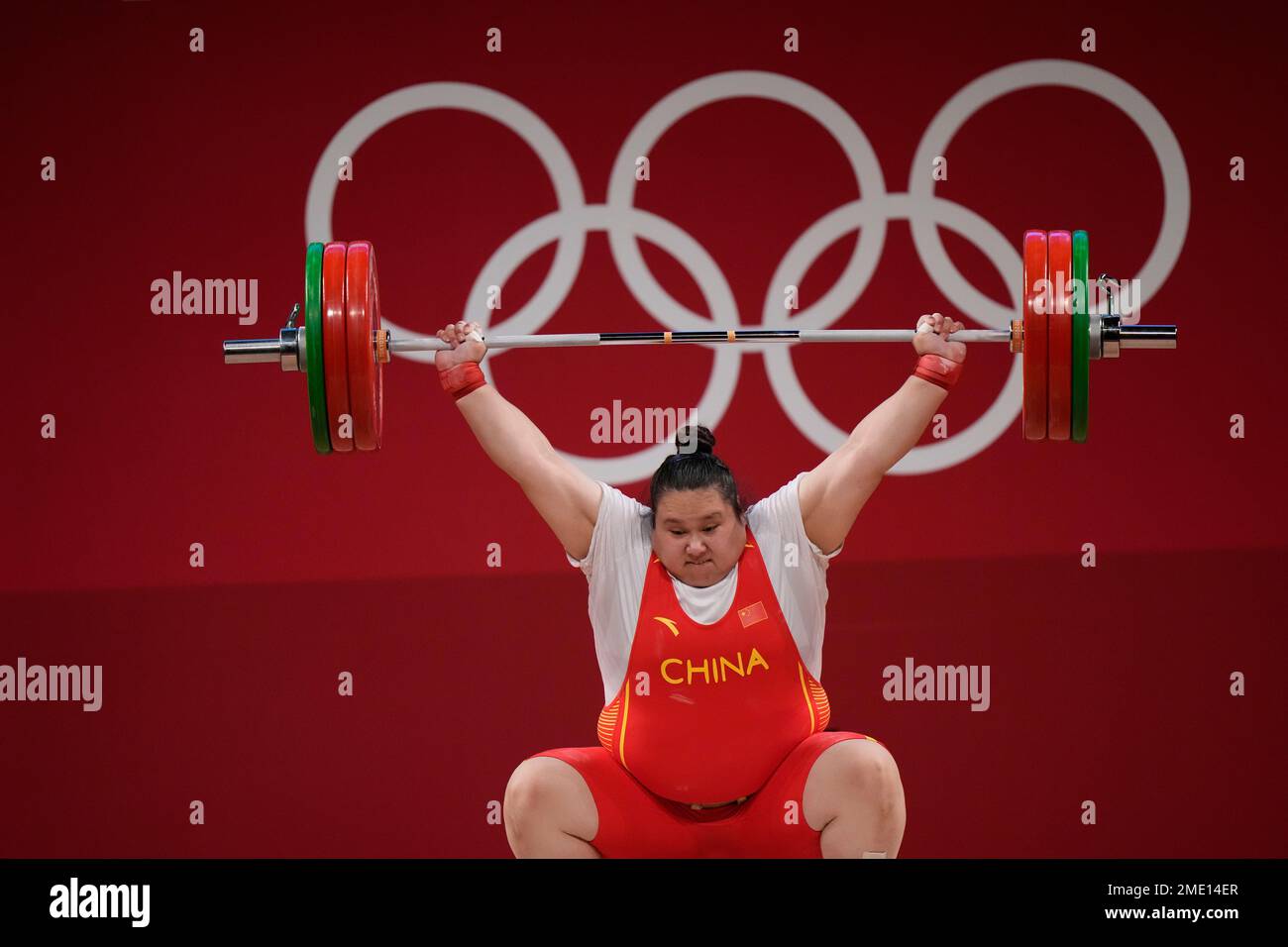 Li Wenwen of China competes in the women's +87kg weightlifting event at ...