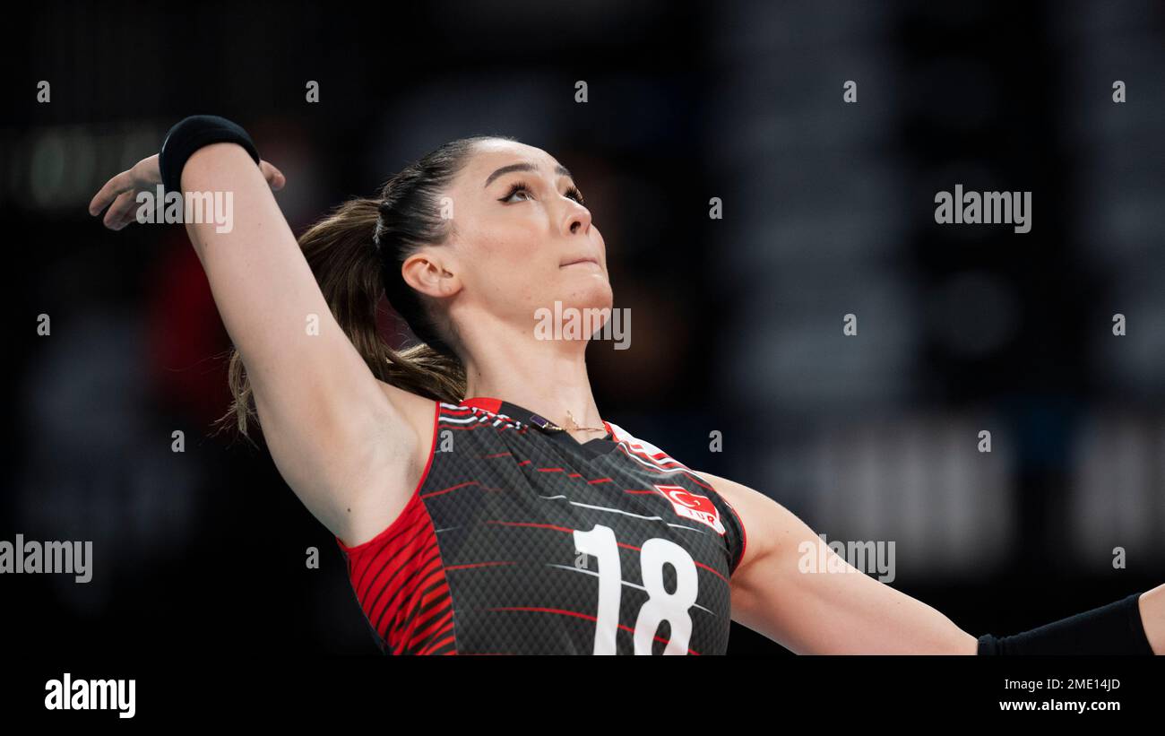 Turkey middle blocker Zehra Gunes leaps to serve at the 2020 Summer ...