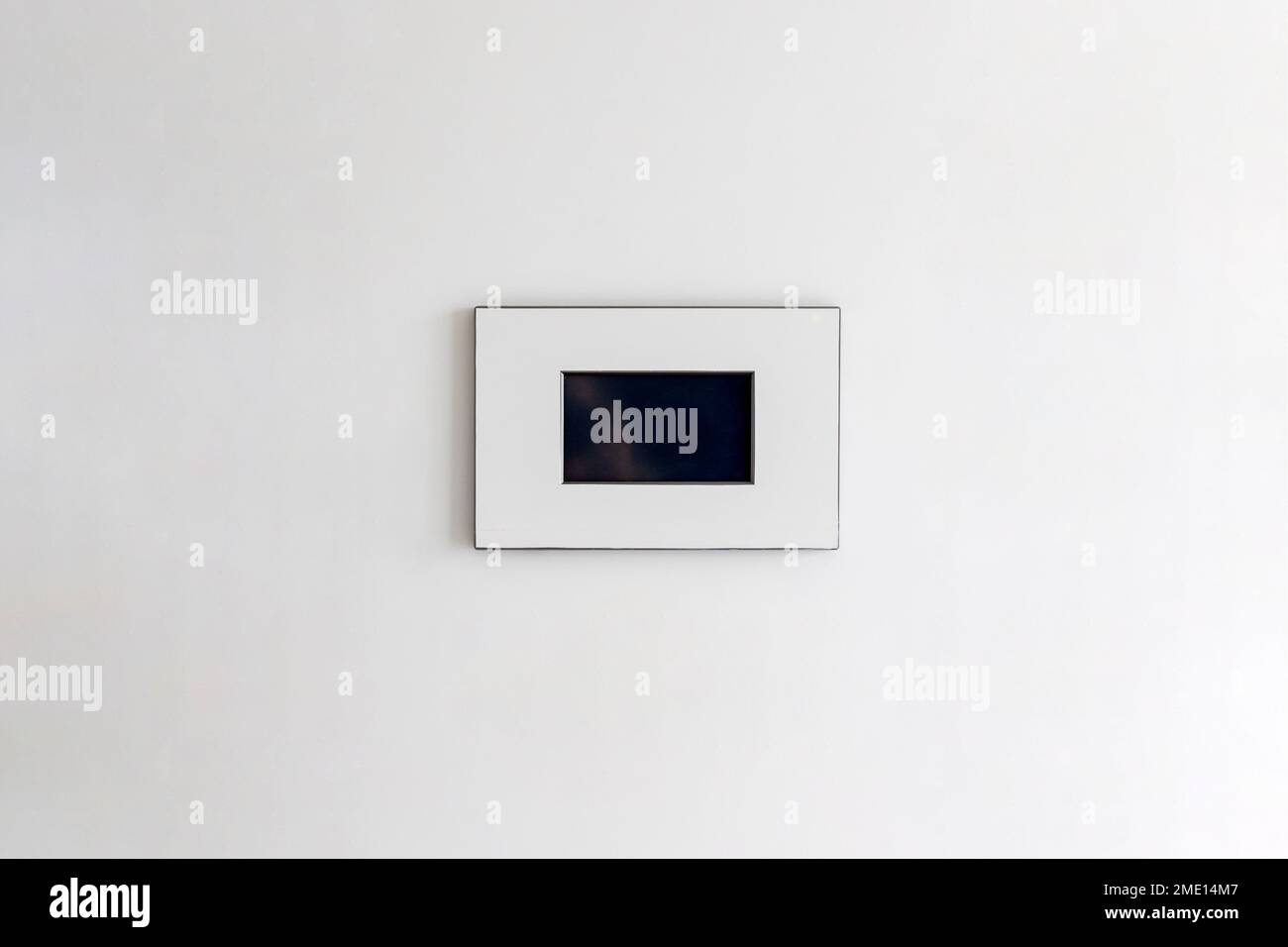 Intercom screen on the white wall Stock Photo - Alamy