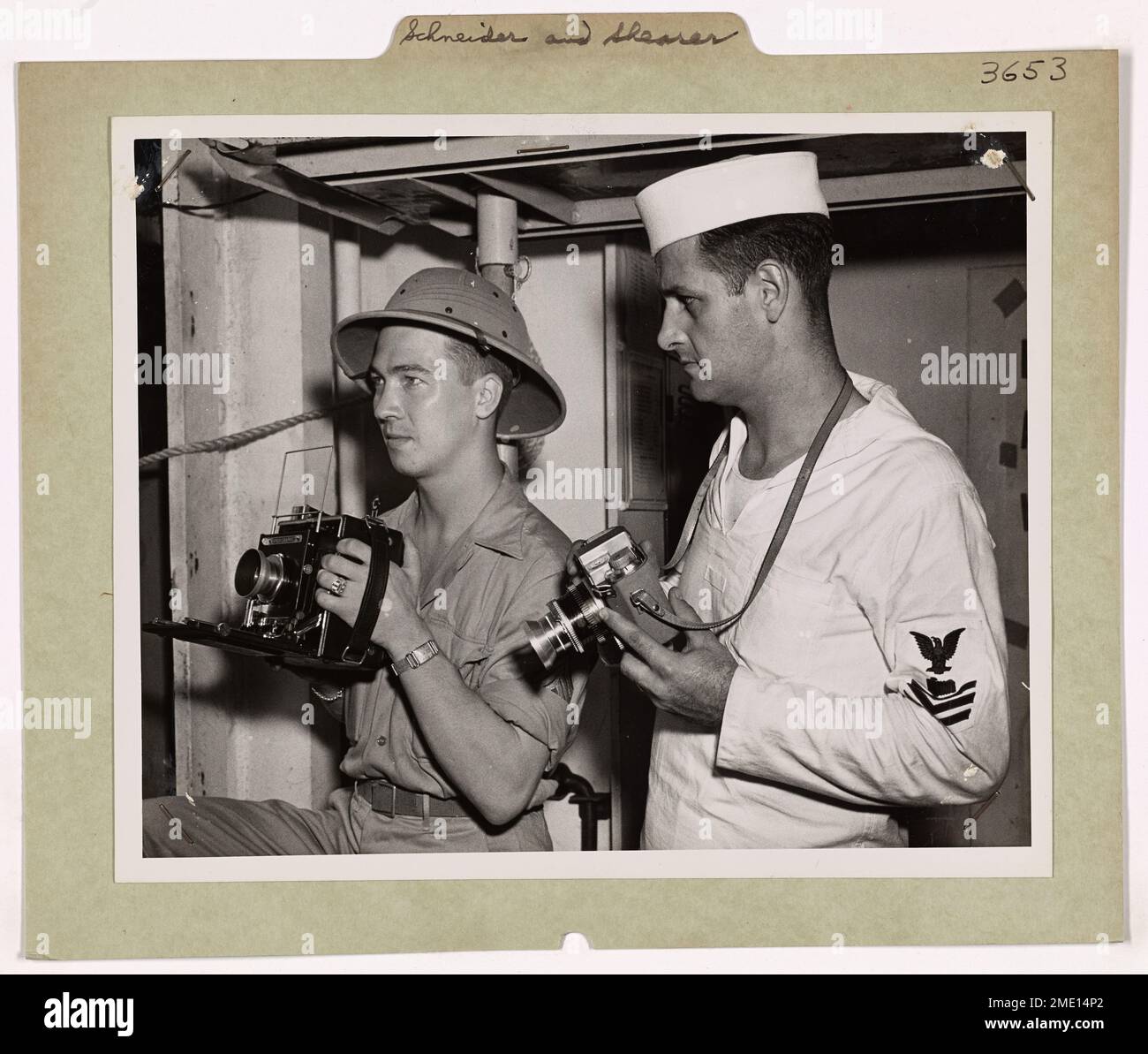 Two photographers from Pittsburgh, Carl F. Schneider of the Coast Guard ...