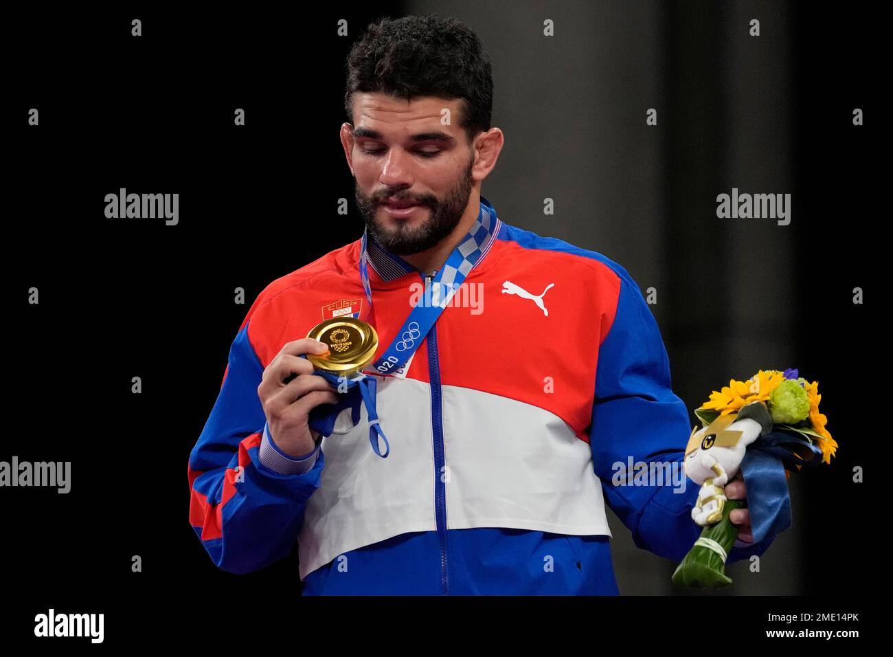 Cuba's Luis Orta Sanchez celebrates during the medal ceremony for the ...