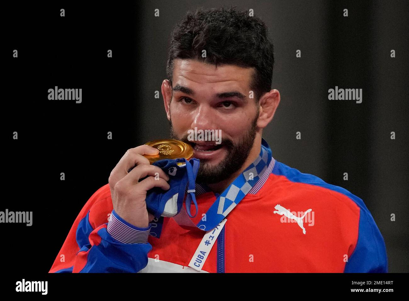 Gold medalist, Cuba's Luis Orta Sanchez celebrates on the podium during ...