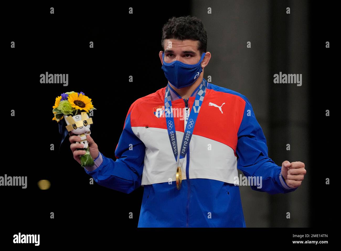 Gold medalist, Cuba's Luis Orta Sanchez celebrates on the podium during ...