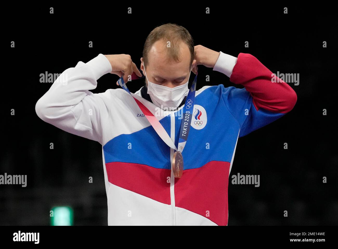 Bronze medalist, Russian Olympic Committee's Sergey Emelin celebrates ...