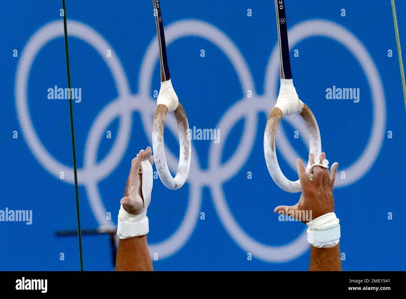 Samir Ait Said, of France, reaches for the rings during competition in ...