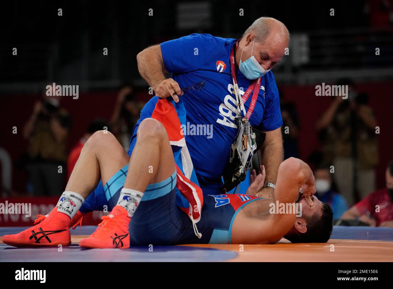 Cuba's Luis Orta Sanchez celebrates with hs coach defeating Japan's ...
