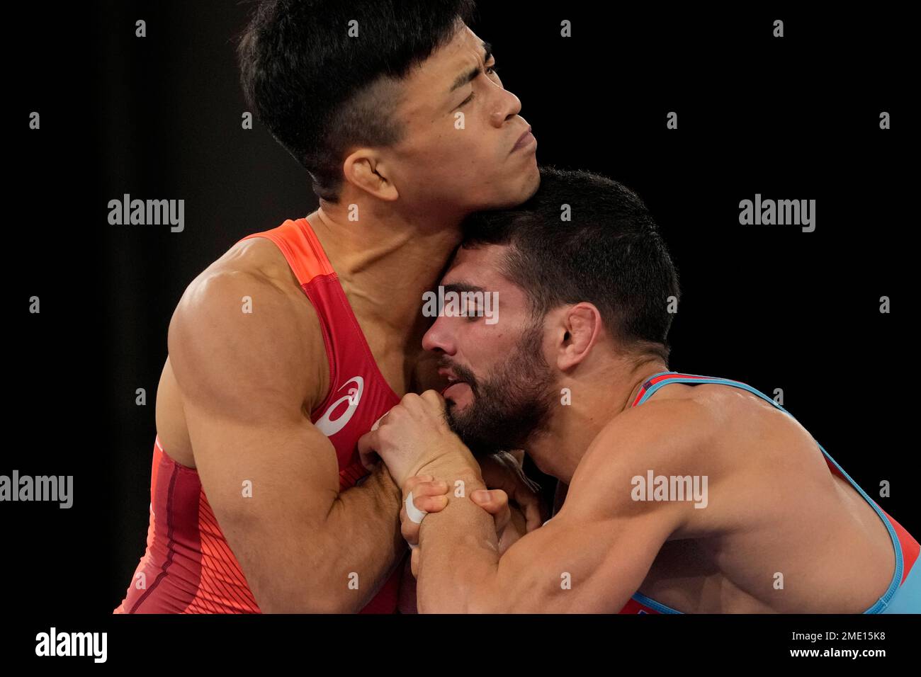 Japan's Kenichiro Fumita, right, and Cuba's Luis Orta Sanchez compete ...