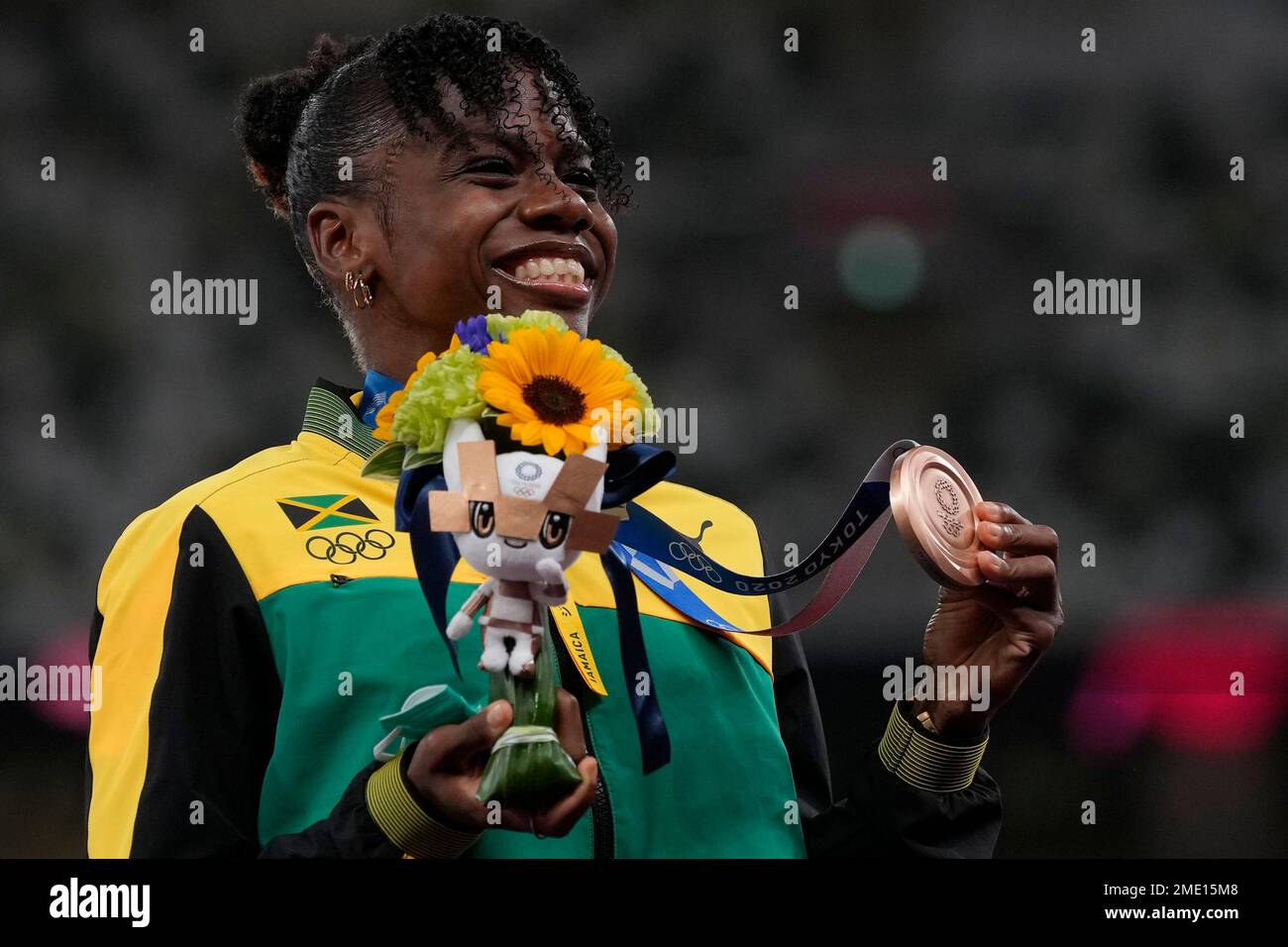 Megan Tapper, of Jamaica, poses with her bronze medal for the women's ...