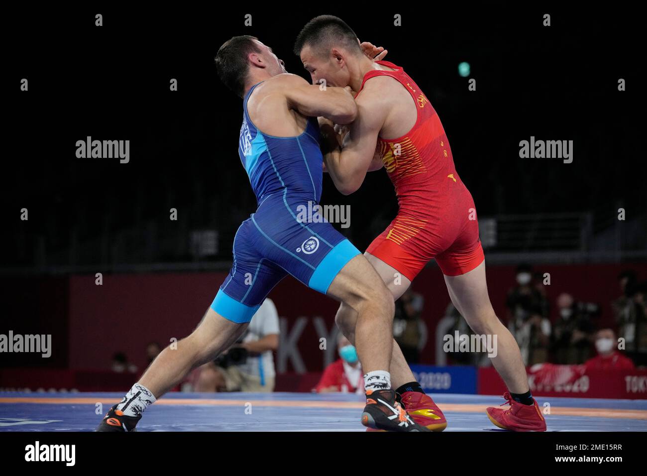 China's Sailike Walihan, right, and Ukraine's Lenur Temirov compete ...
