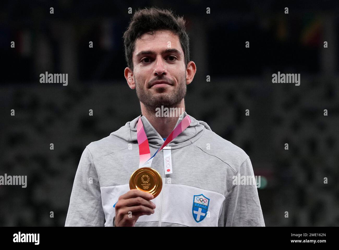 Miltiadis Tentoglou, of Greece, poses with his gold medal after winning ... Miltiadis Tentoglou, of Greece, poses with his gold medal after winning ...