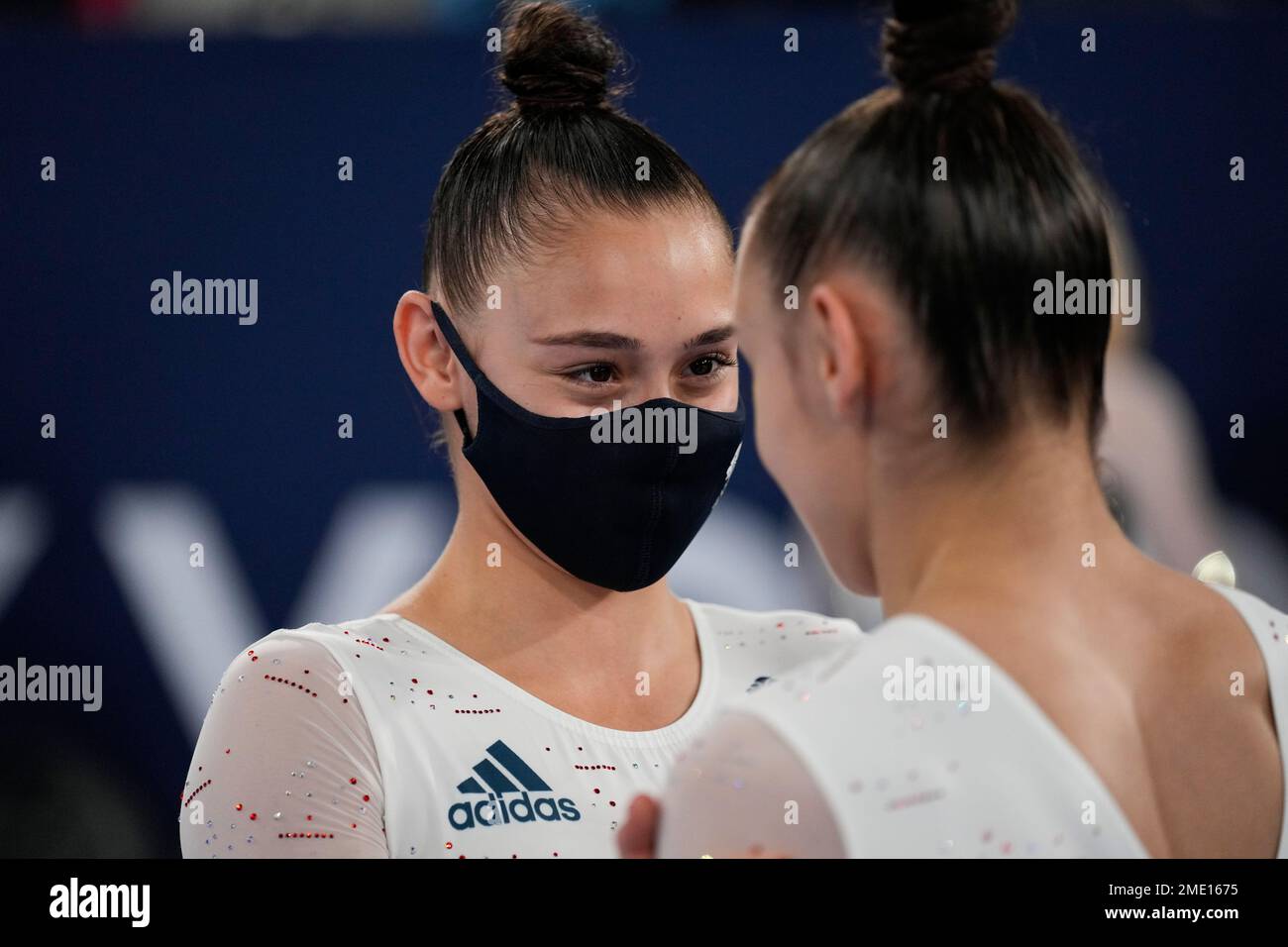 Jessica Gadirova, of Britain, left, greets her twin sister Jennifer ...