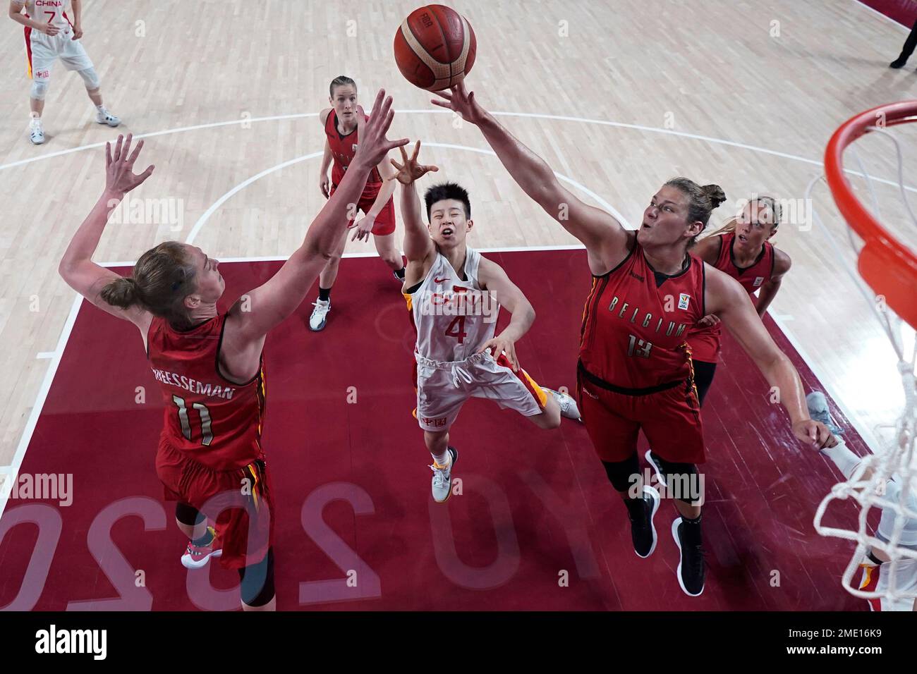 China's Yuan Li (4) shoots against Belgium's Emma Meesseman (11) and ...